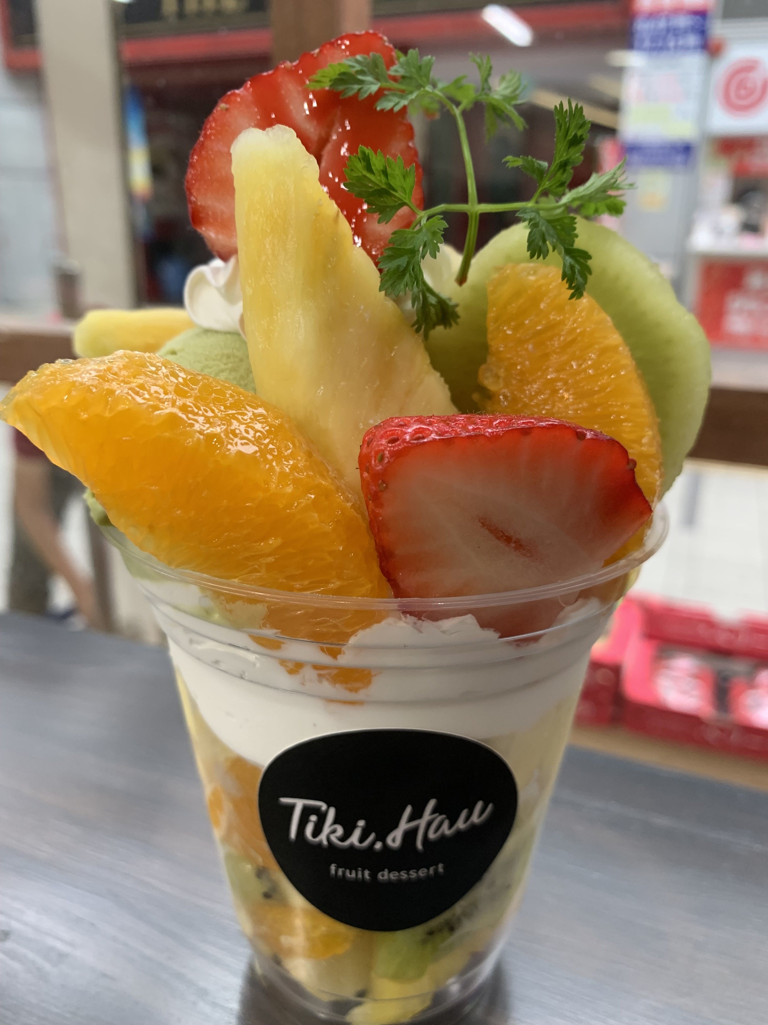 It's like a fruit tower! A parfait filled with fresh fruit that is made ...